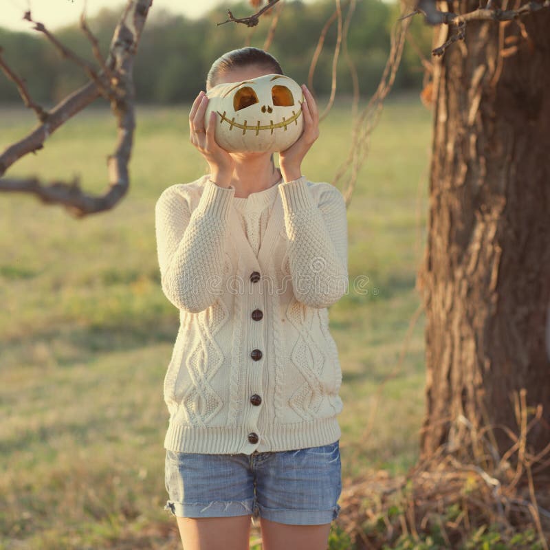 Girls with pumpkin face stock photo. Image of knitwear - 44839500