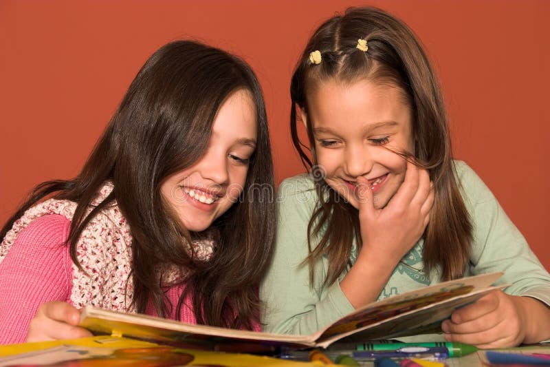 Girls reading book stock photo. Image of couple, play - 2041032