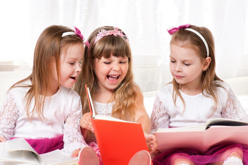 Girls reading book stock photo. Image of couple, play - 2041032