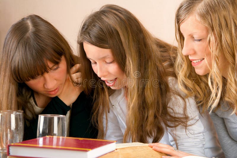 Girls Reading Together stock image. Image of beautiful - 2156823