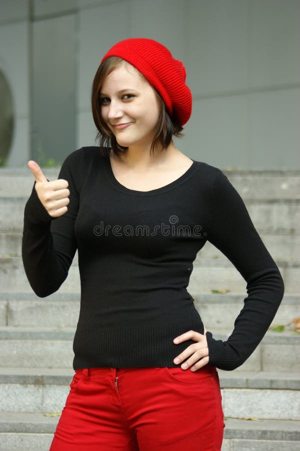 Girls With Red Cap Stretches Thumb In The Air Picture. Image: 6202145