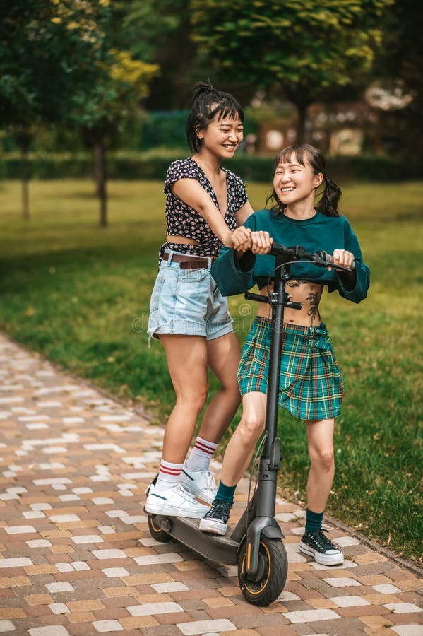 Girls Riding Electric Scooter and Feeling Excited Stock Photo - Image ...