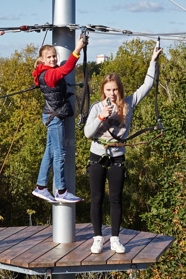 Girls Run an Obstacle Course in Climbing Park Stock Photo - Image of ...