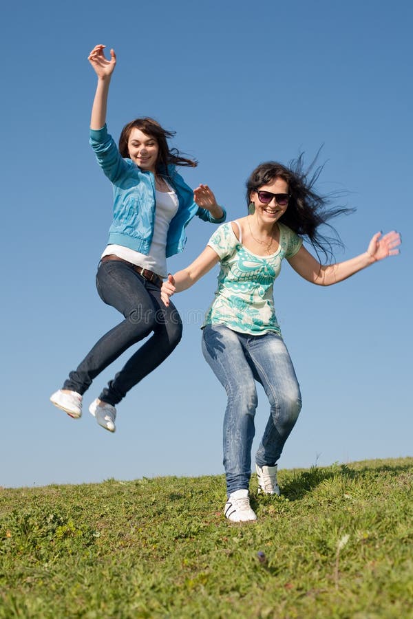 Two Girls Running Along the Seashore Stock Image - Image of action ...