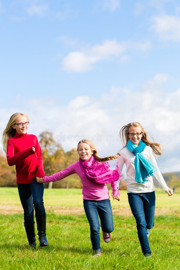 Girls Running through Fall or Autumn Park Stock Image - Image of ...