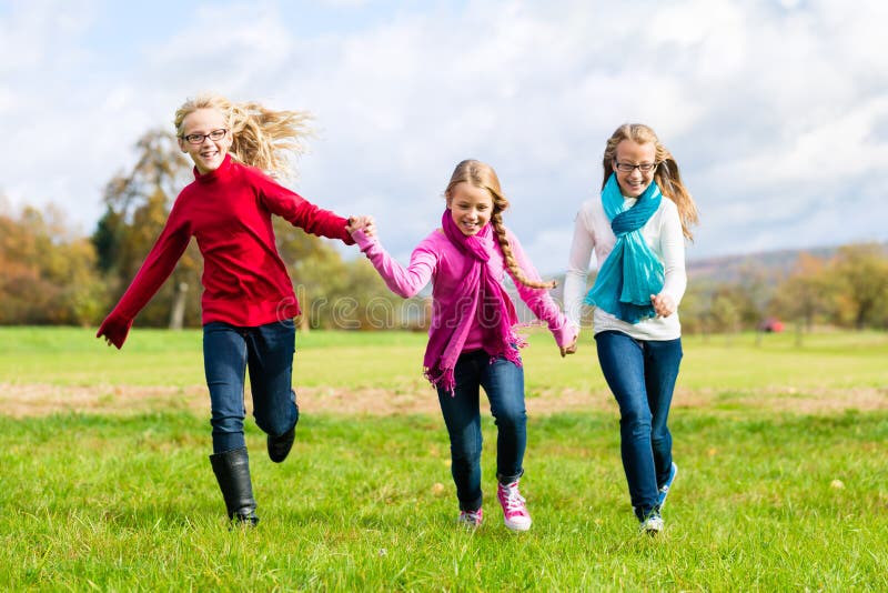 Girls Running through Fall or Autumn Park Stock Image - Image of nature ...