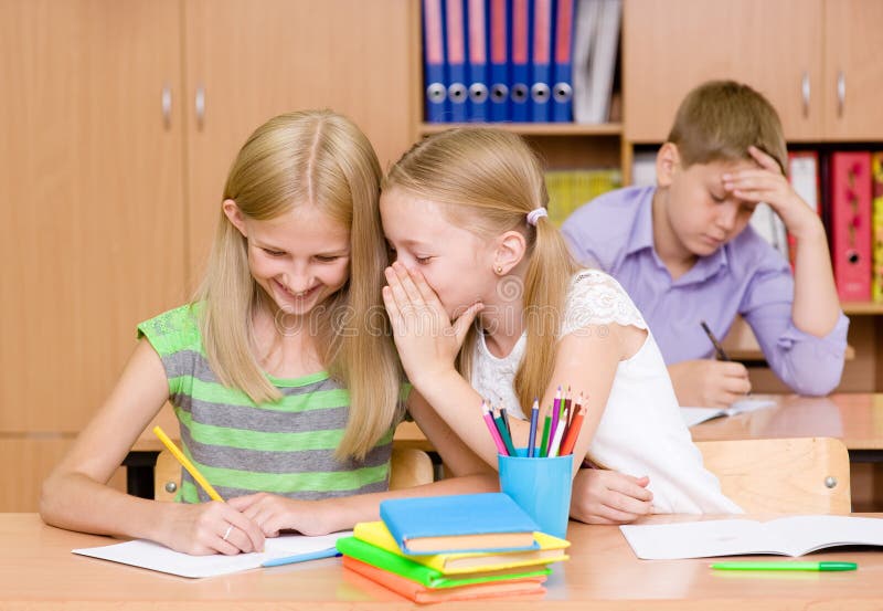 Girls Sharing Secrets in Classroom Stock Image - Image of elementary ...