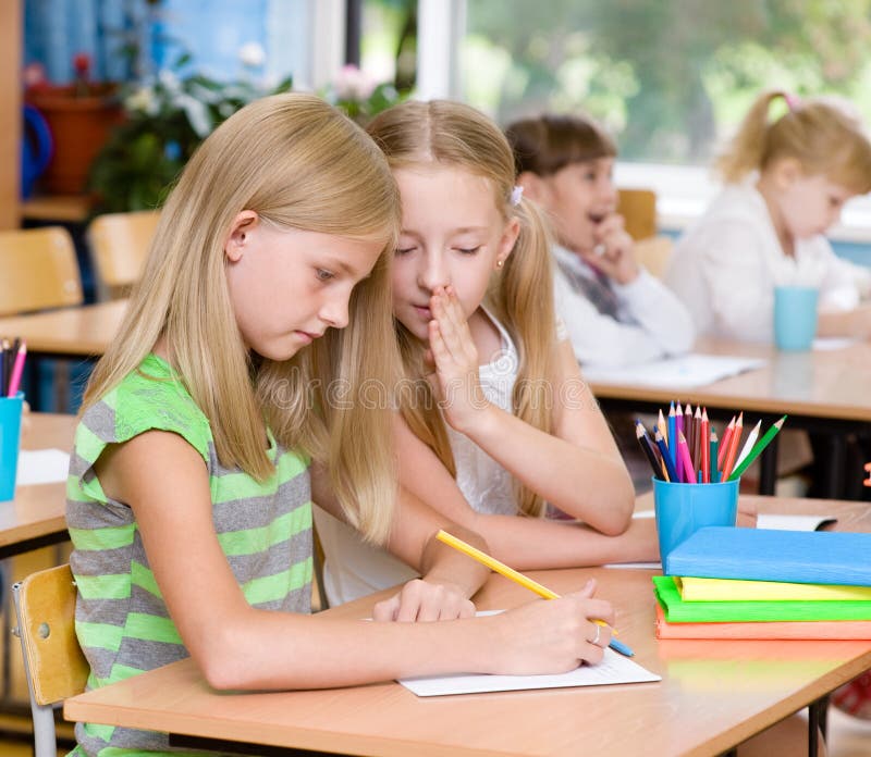 Girls Sharing Secrets in Classroom Stock Photo - Image of girls, read ...