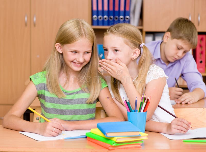 Girls Sharing Secrets in Classroom Stock Image - Image of lesson ...