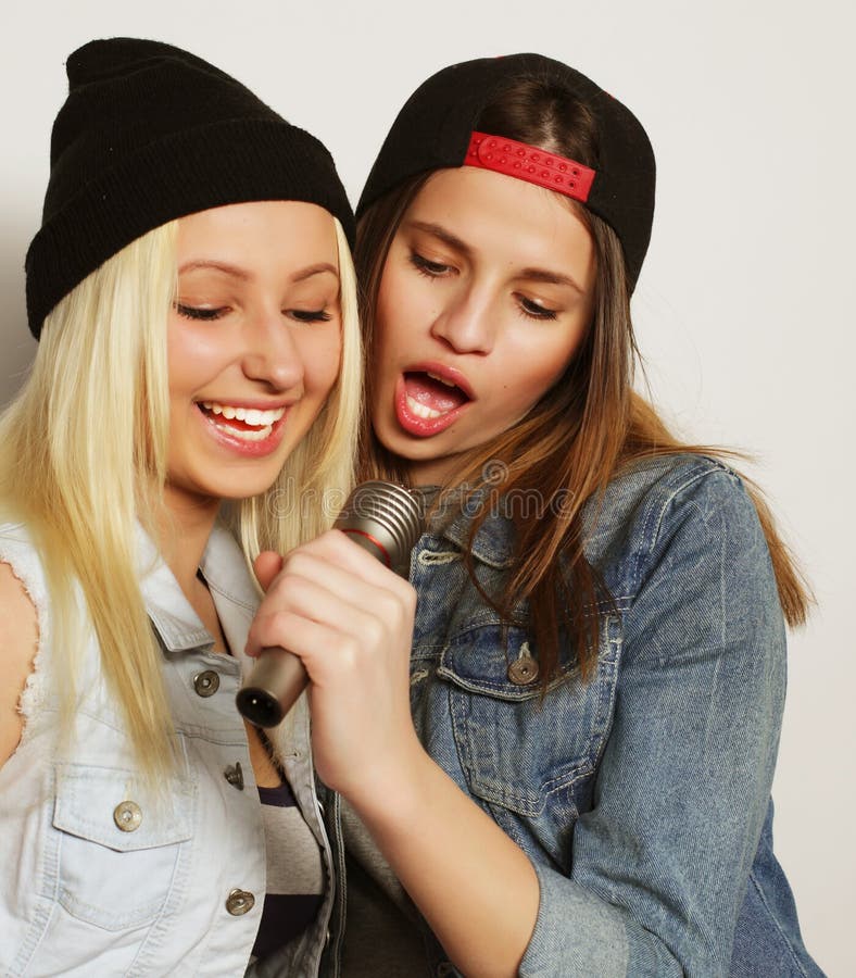 632 Two Girls Microphone Singing Stock Photos - Free & Royalty-Free ...