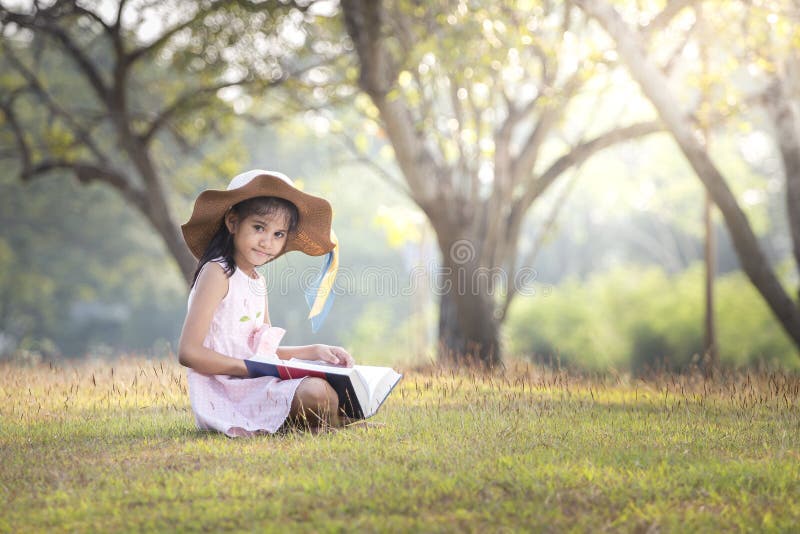 Girls sit and reading stock image. Image of learn, trees - 53012117