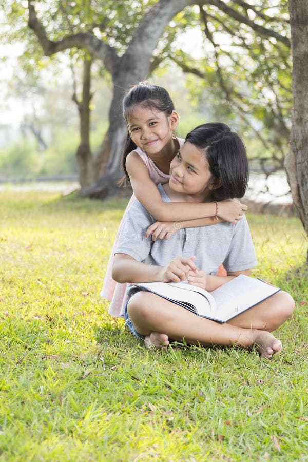 Girls sit and reading stock photo. Image of plant, daughter - 52645882