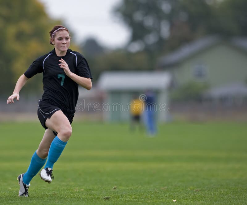 Girls Soccer Player Running Stock Photo - Image of athletics, dribbling ...