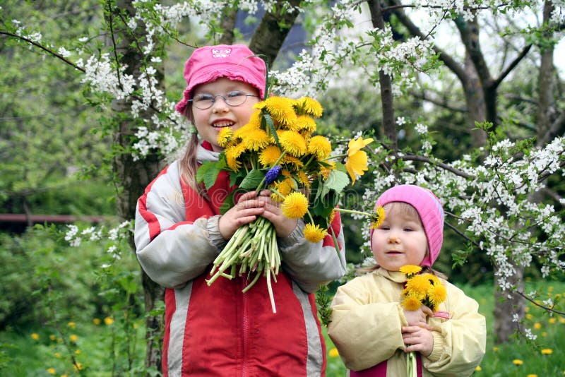 Girls with spring flowers stock photo. Image of outside - 5175472