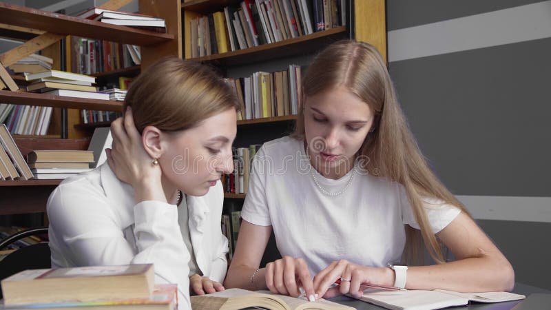 4K. the Girls Study Together in the Library. Students Prepare for Exams ...