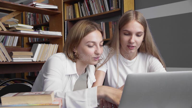 The Girls Study Together in the Library. Students Prepare for Exams ...
