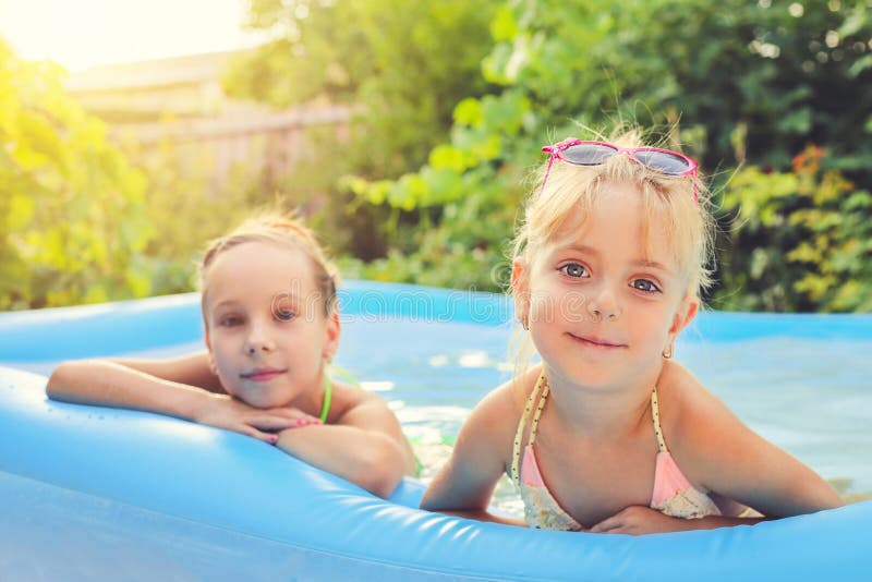Girls Swimming in the Pool. Stock Photo - Image of children, healthy ...