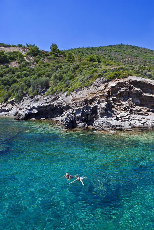 Girls swimming in the sea editorial stock photo. Image of clear - 28748058