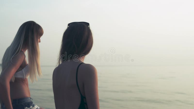 Girls in Swimsuits on the Beach, Sunset Stock Video - Video of stones ...