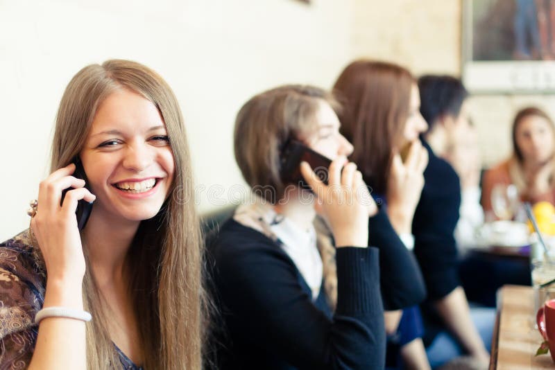 Girls Talking on Cell Phone in Cafeteria Stock Image - Image of style ...