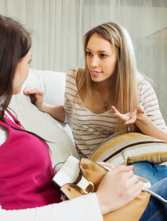 Girls talking on sofa stock image. Image of chatting - 40777585