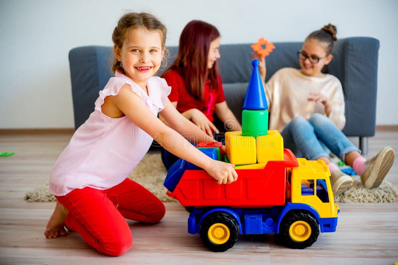 Girls with toy car stock image. Image of happy, adorable - 95201657