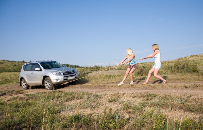 Girls tugging car stock image. Image of haulage, summer - 12261175