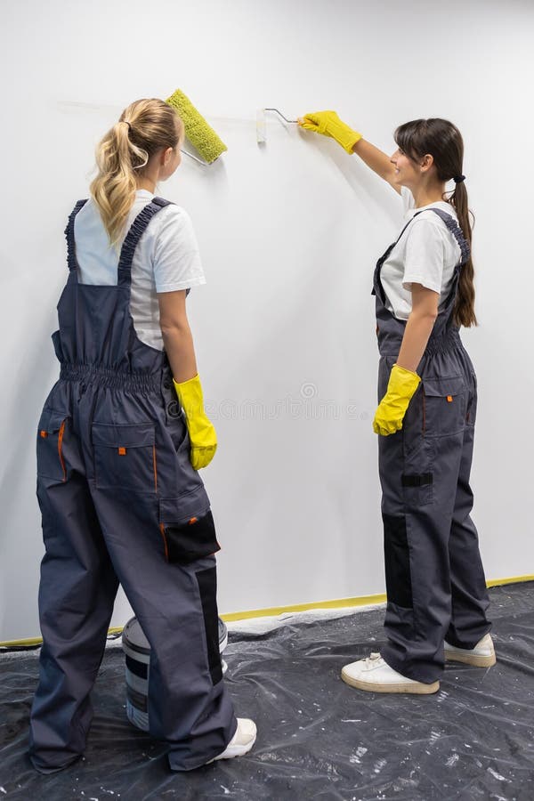 Girls in Uniform Painting the Wall and Enjoying the Process Stock Photo - Image of painting ...
