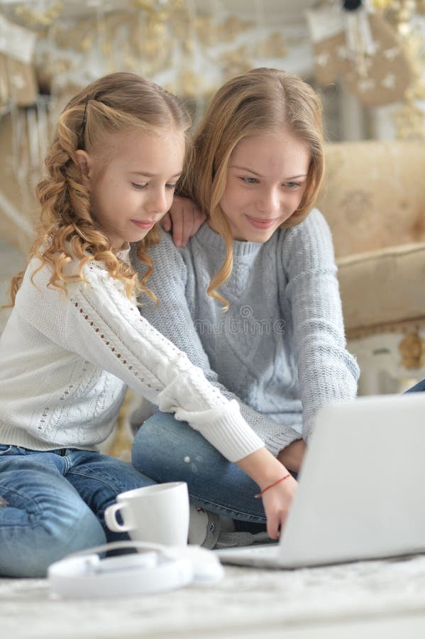 Girls Using Laptop at Home on Christmas Stock Photo - Image of beauty ...
