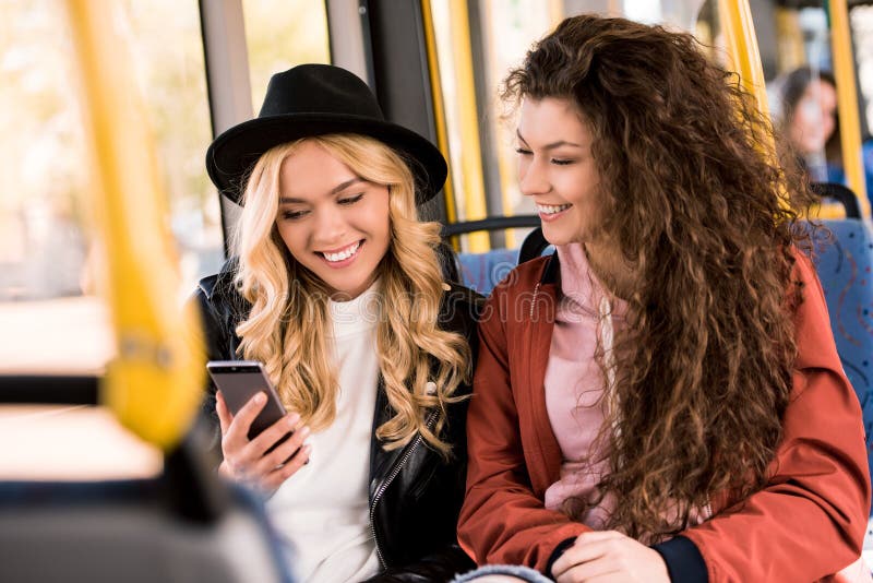 Beautiful Smiling Girls Using Smartphone Stock Photo - Image of traffic ...