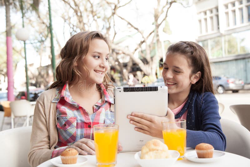 Girls Using the Tablet in the Street Stock Photo - Image of phone, cafe ...