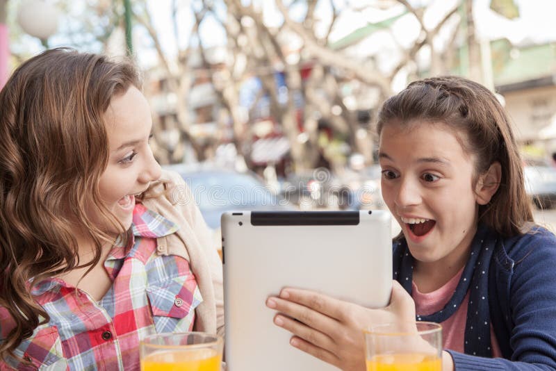 Girls Using the Tablet in the Street Stock Photo - Image of girls ...