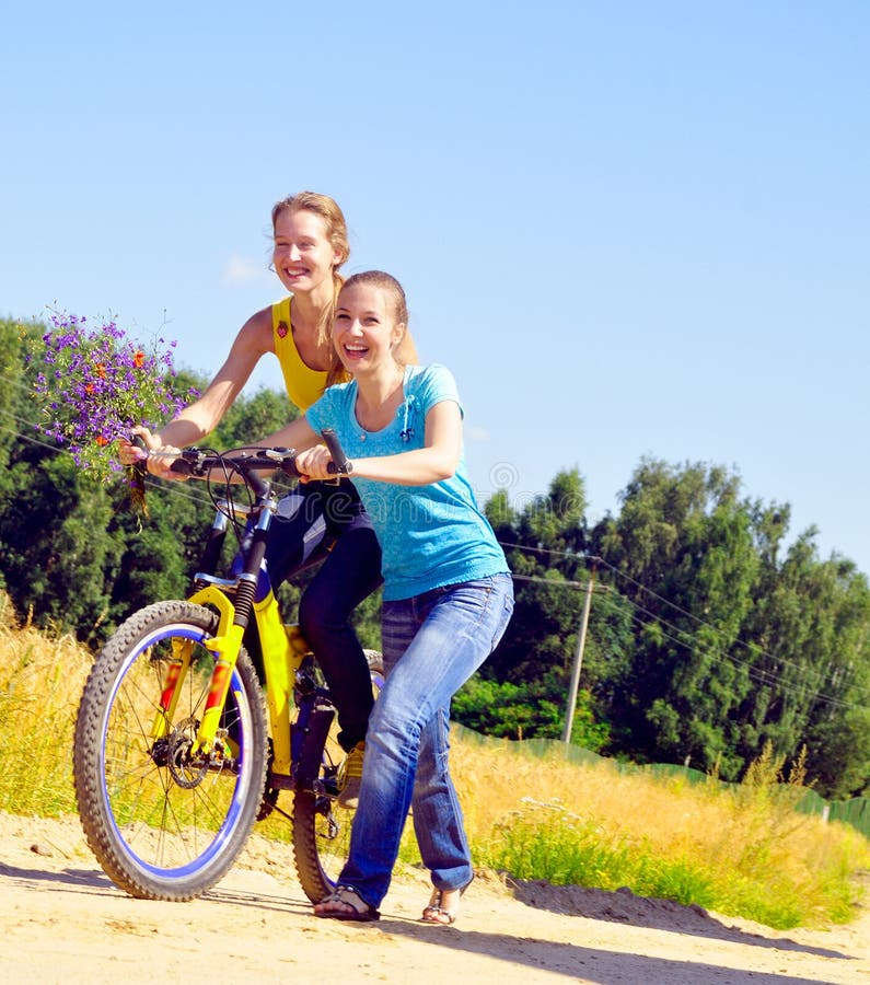 Girls Walk Up the Hill with Bicycle on Village Stock Photo - Image of ...