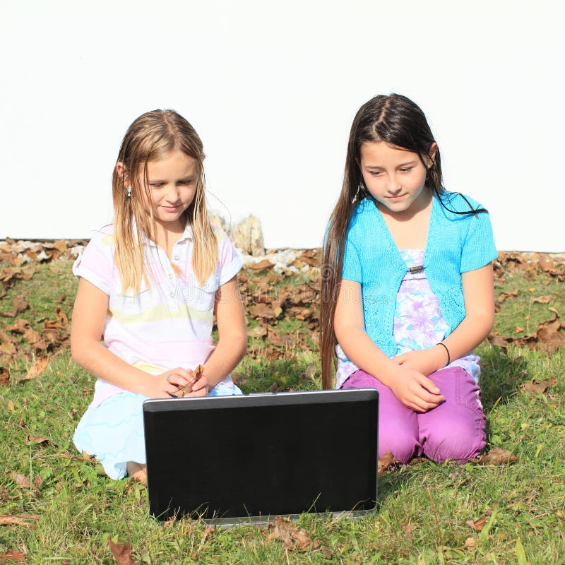 Girls watching notebook stock photo. Image of watch, play - 34549824