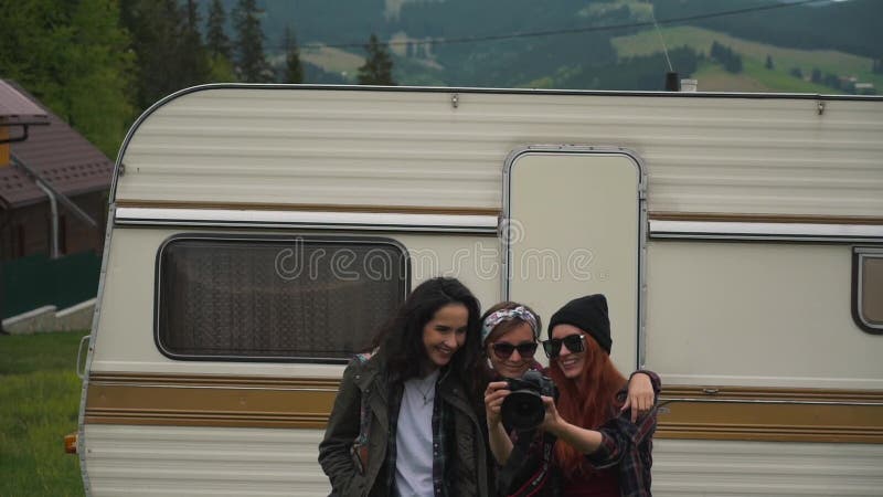 Girls are Watching Photos Near Caravan Stock Video - Video of camper ...