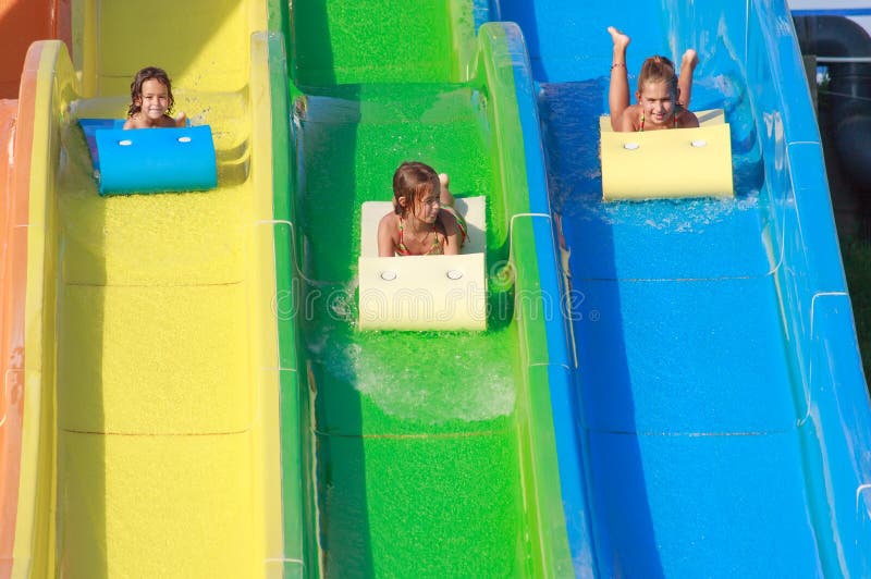 Girls on the water slide stock photo. Image of amusement - 26738406