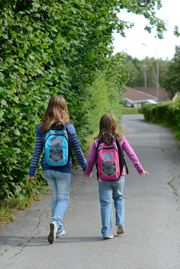 Girls on the way to school stock photo. Image of elementary - 26296164