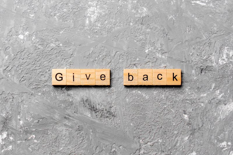 Give Back Word Written on Wood Block. Give Back Text on Table, Concept ...