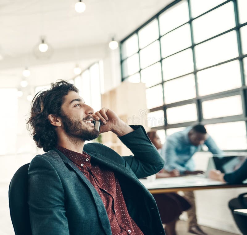 Give Him a Call, Hell Get it Done. Shot of a Young Businessman Using a ...
