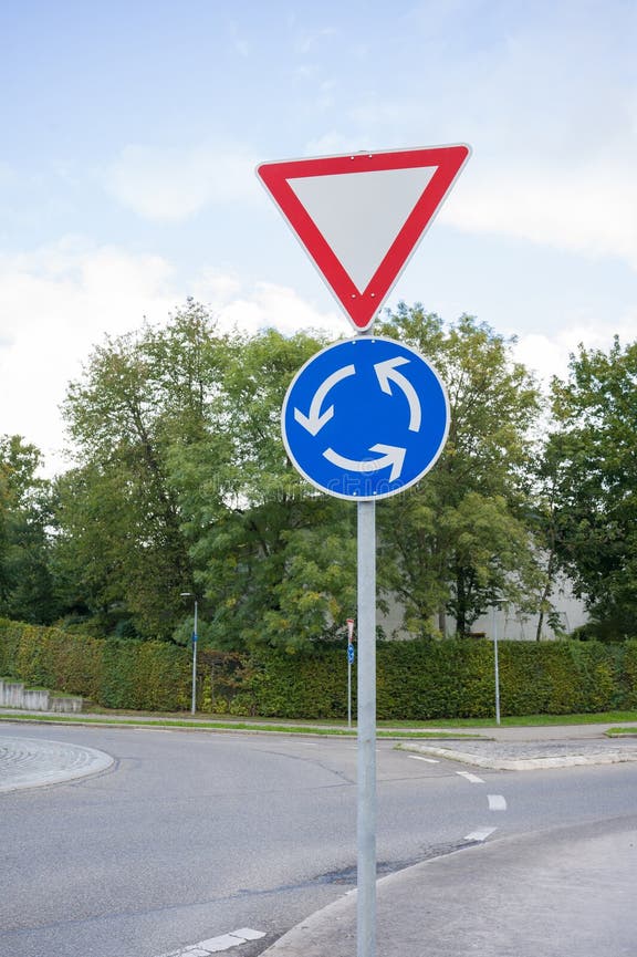 Give Way Road Sign and Roundabout Stock Photo - Image of direction ...