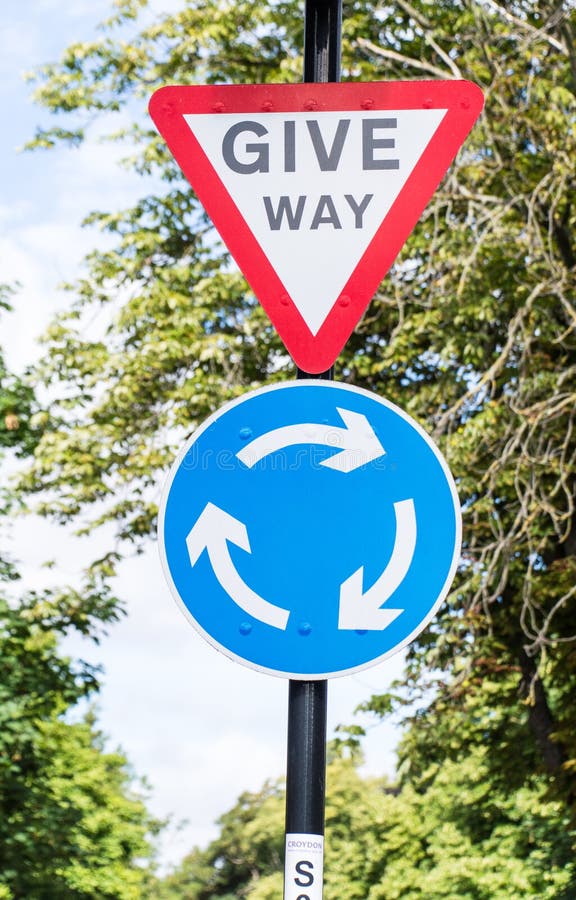 Give Way and Roundabout Road Sign Uk Editorial Photo - Image of roads ...