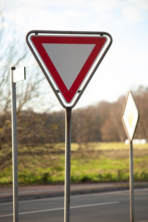 Give-way sign on a road editorial photo. Illustration of information ...