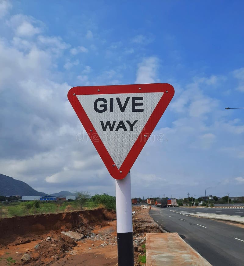 Give Way Sign on the Road Under Blue Sky Stock Image - Image of nature ...