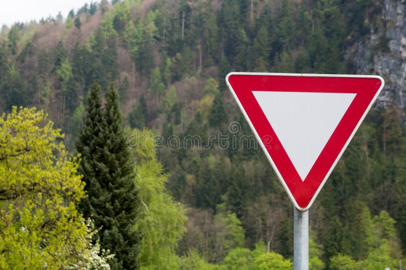 Give Way Triangular Shaped Street Traffic Sign On The Rural Road Area ... Give Way Triangular Shaped Street Traffic Sign On The Rural Road Area ...