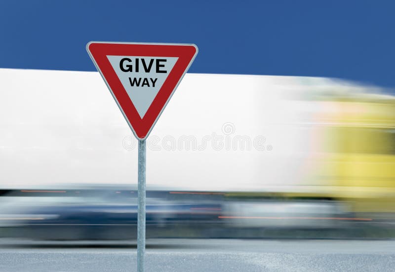 Give Way Yield Traffic Sign And Truck Stock Photo - Image of bright ...
