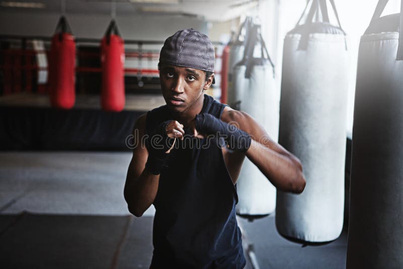 Give Your Best Shot. a Kick-boxer Training in a Gym. Stock Photo ...