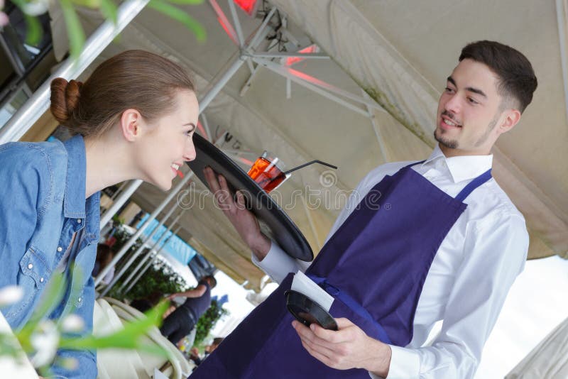 Waiter Giving Back a Wallet Stock Photo - Image of cordial, joint: 26934914