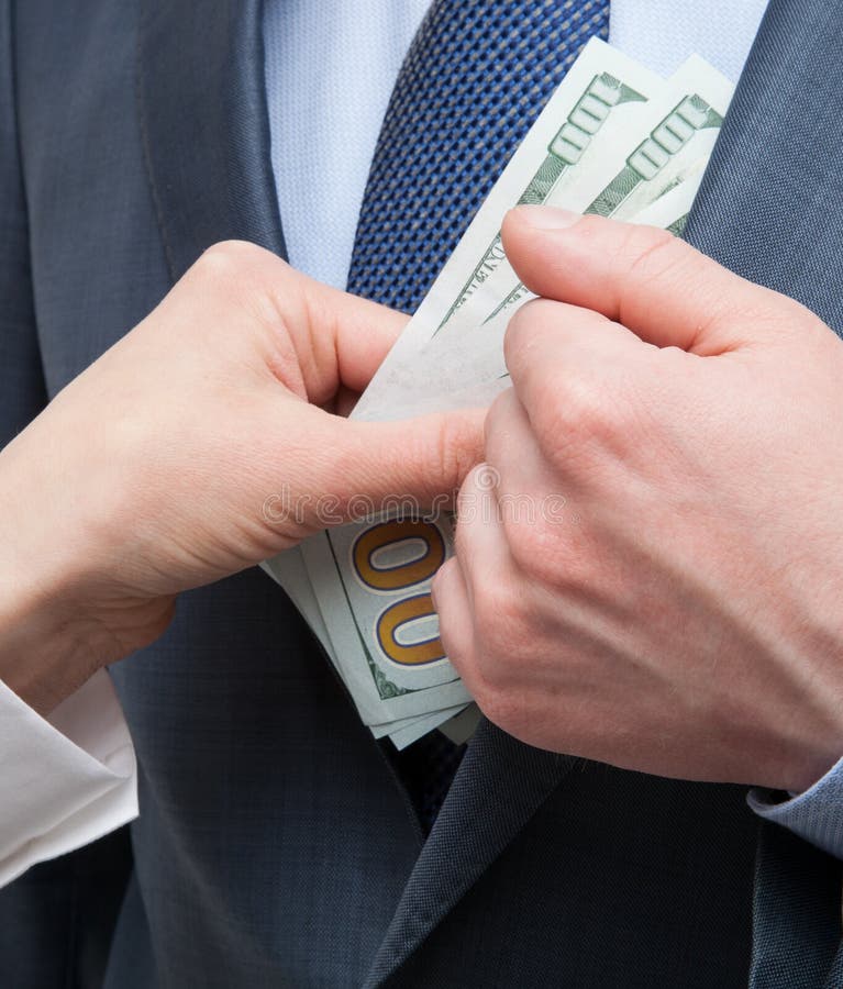 Giving a Bribe into a Pocket Stock Photo - Image of corrupt, corporate ...