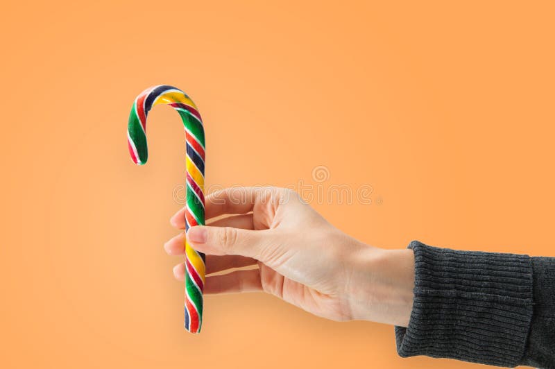 Giving a candy cane stock image. Image of isolated, bright - 64209509