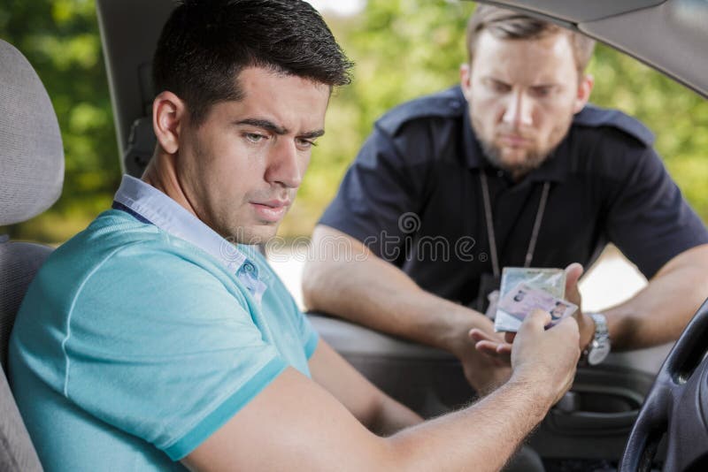 Giving a driving licence stock photo. Image of driver - 69945288